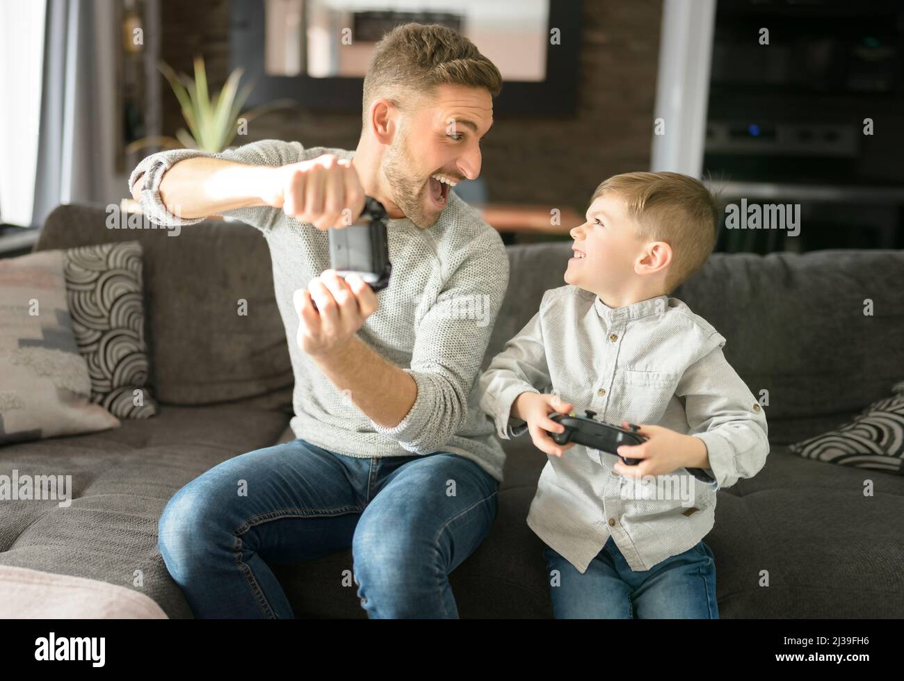 Father or Godfather having fun on the living room At Home play video ...