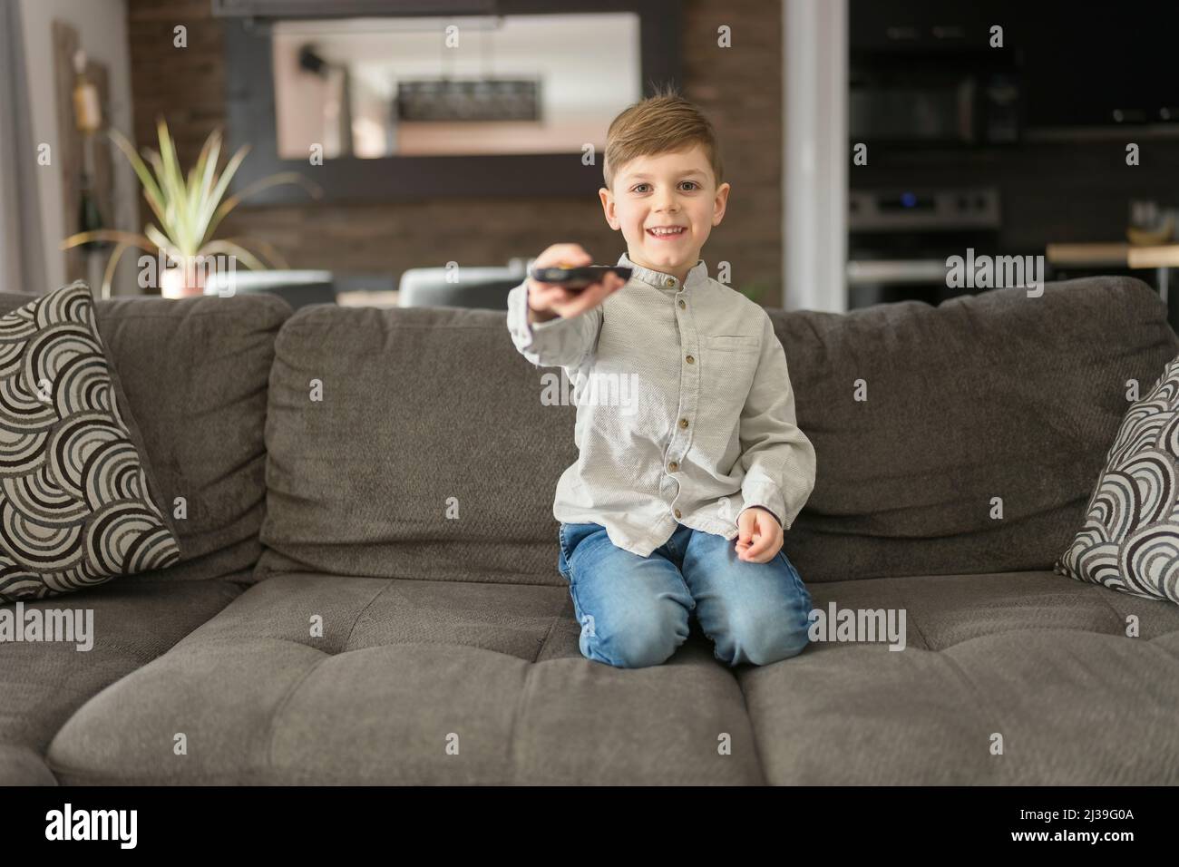 boy watching television sit on the sofa at home Stock Photo - Alamy