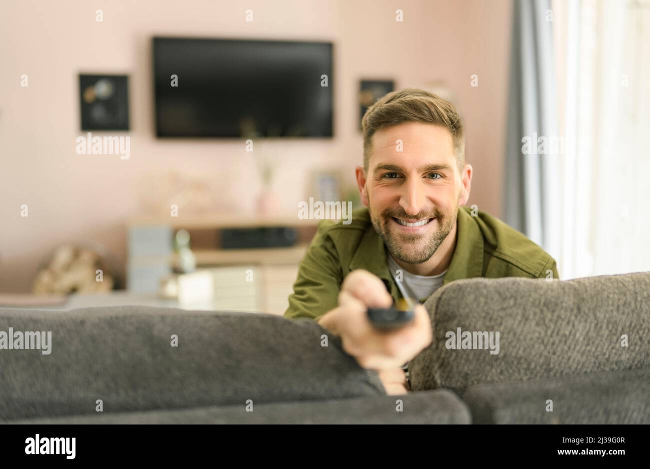 Man sitting with tv for head with face hi-res stock photography and ...