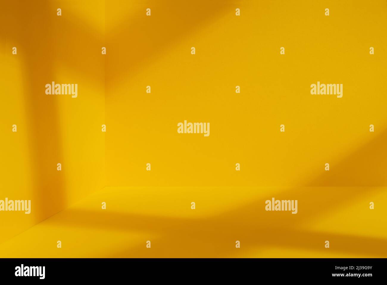 Yellow room corner with crossing windows shadows. Minimalistic space ...