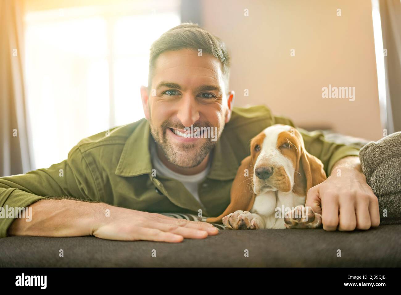 Man stroking dog home hi-res stock photography and images - Alamy