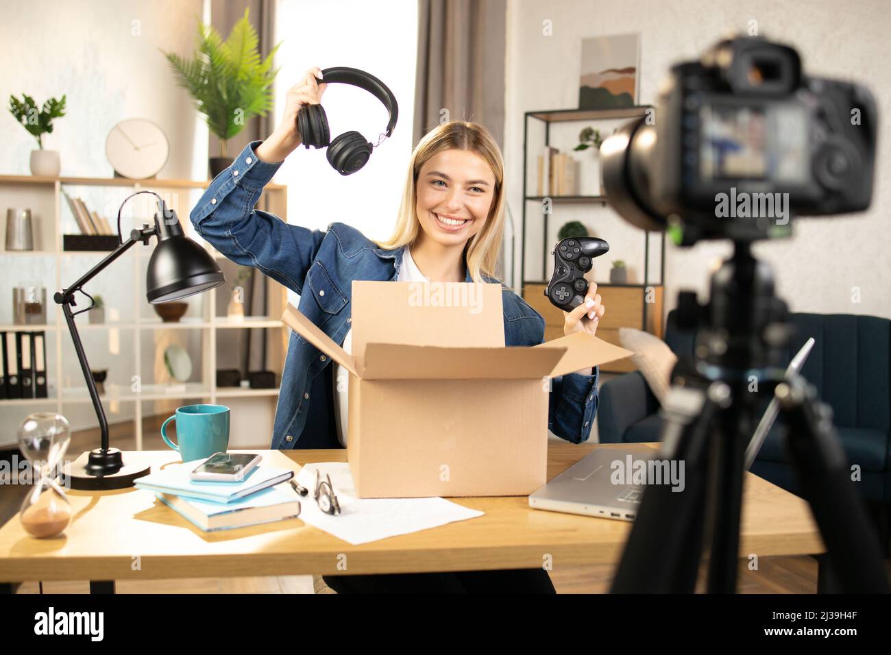 Happy smiling Caucasian female influencer recording video on camera ...