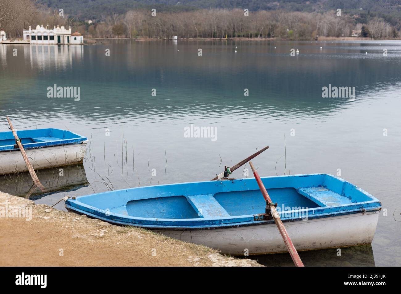 Empty rowboat in water hi-res stock photography and images - Alamy