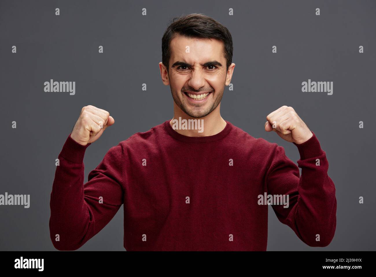 successful man posing smile gesture hands red sweater isolated ...
