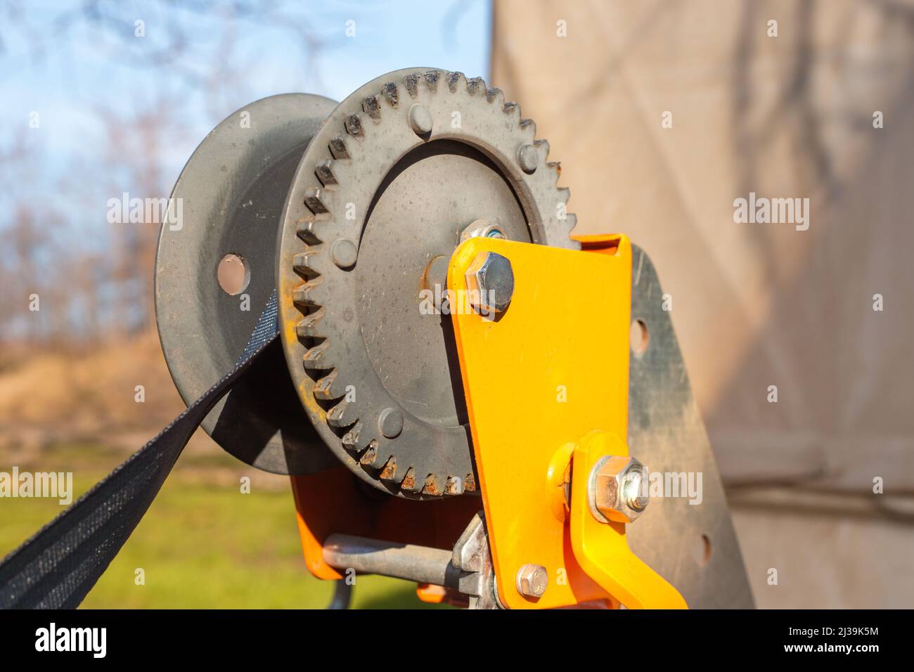 Hand winch mechanism close up. Iron gear of a traction winch with a ...