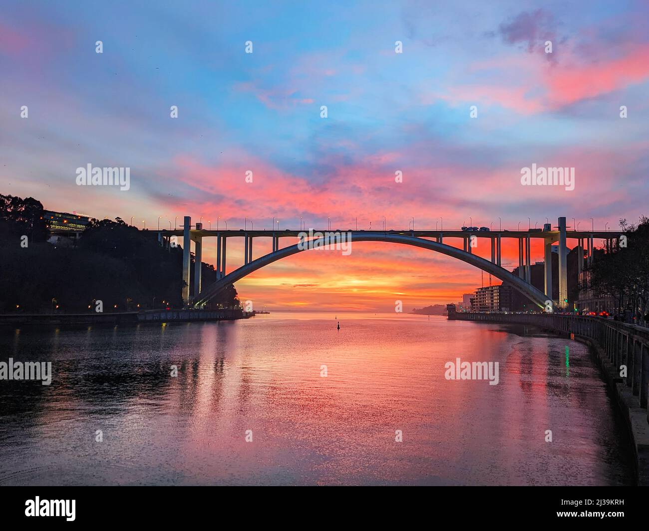 Scenic colorful sunset over Arrabida bridge, Porto cityscape, Portugal ...