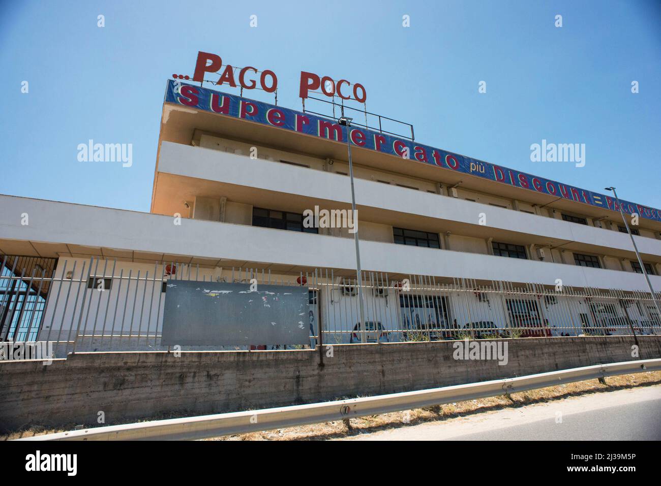Locride, Italy 03/07/2017: "Pago Poco" supermarket on the road to ...