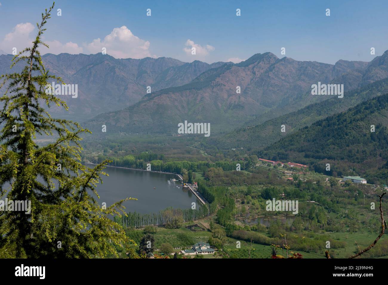 An aerial view of a part of Dal lake with a backdrop of zabarwan ...