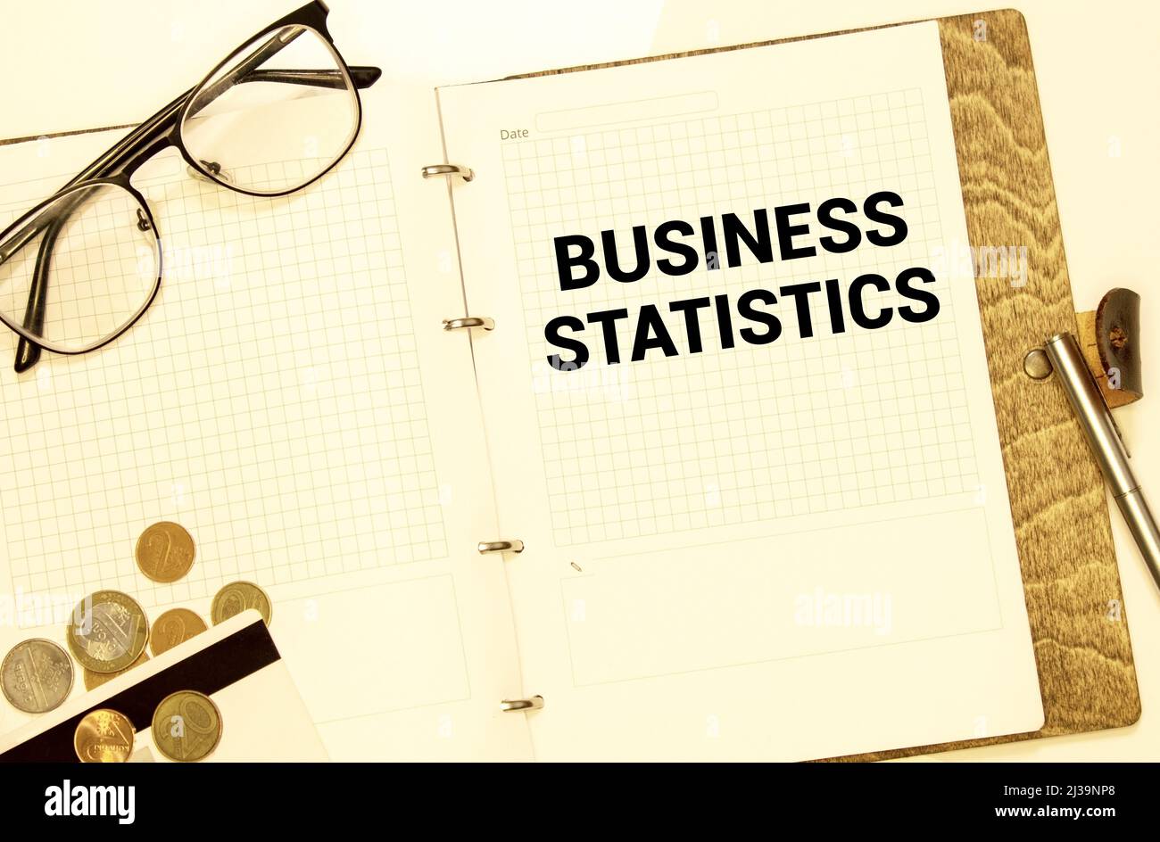 Text BUSINESS STATISTICS on sticker on notepad on diagram background ...