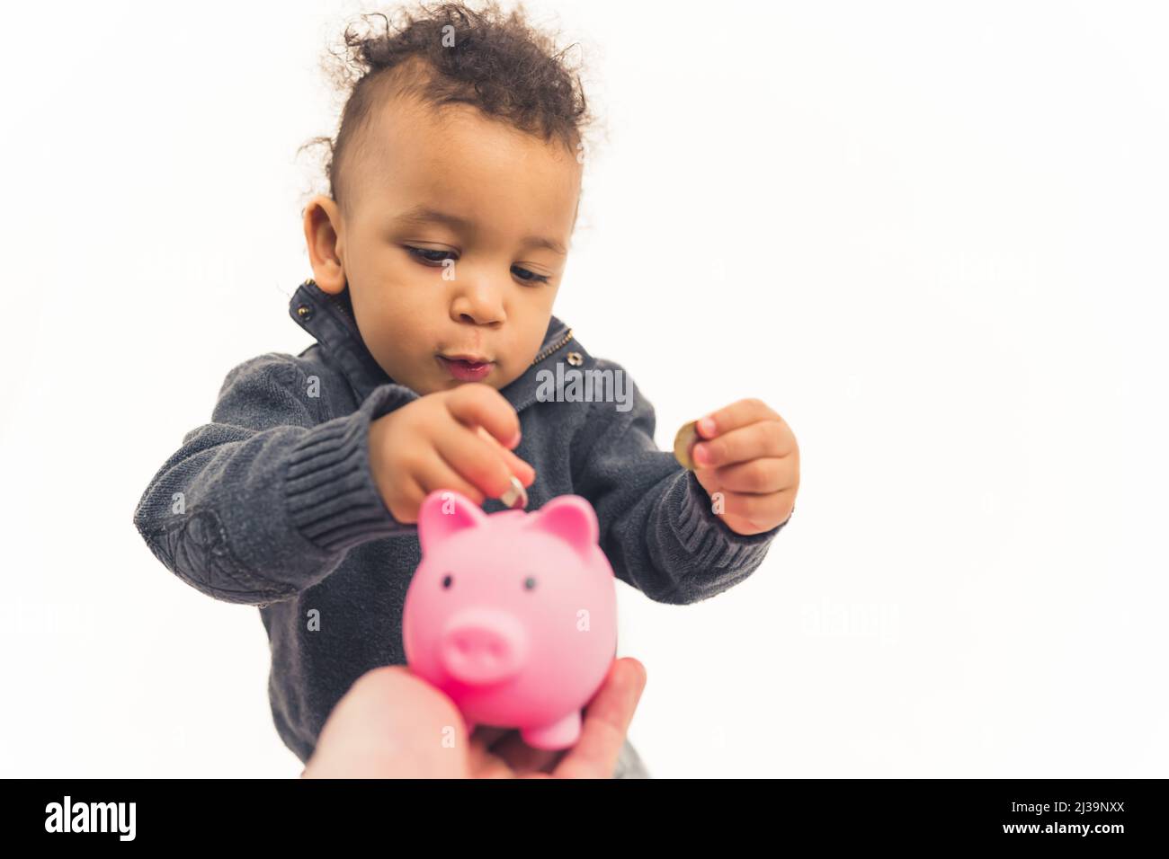 Boy counting coins hi-res stock photography and images - Alamy
