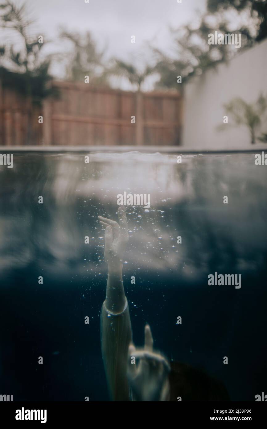 Hand reaching underwater hi-res stock photography and images - Alamy