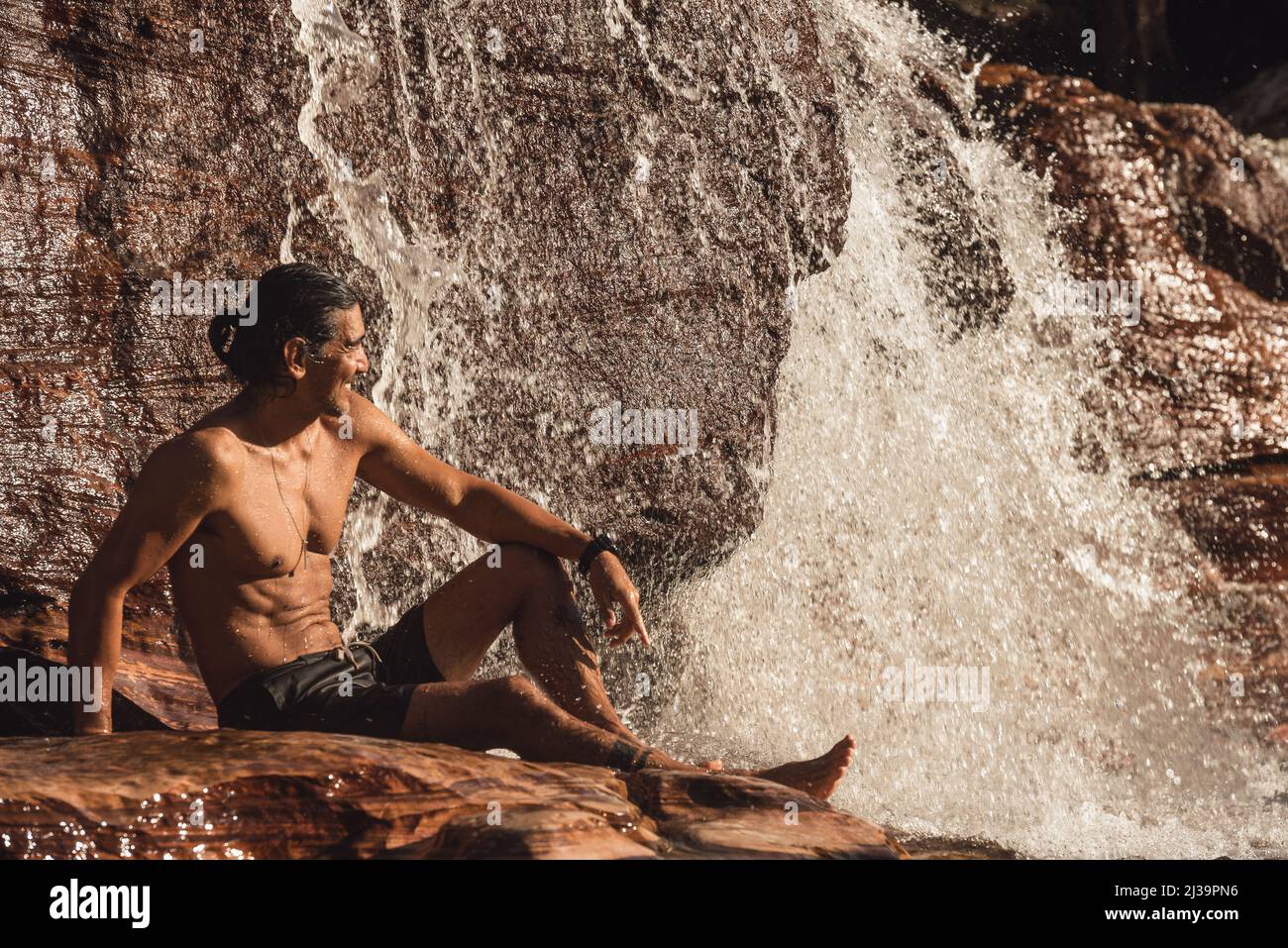 Man bathing in waterfall hi-res stock photography and images - Alamy