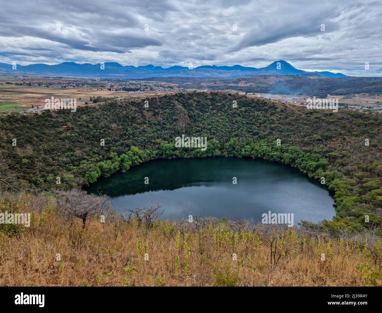 View towards a water eye in an unexplored volcano Stock Photo - Alamy