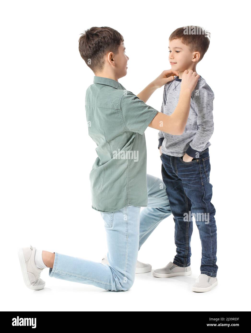 Portrait of cute brothers on white background Stock Photo - Alamy