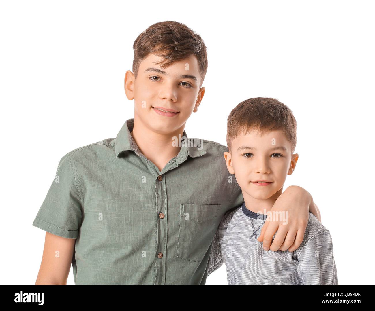 Two brothers embrace isolated on white background Stock Photo - Alamy
