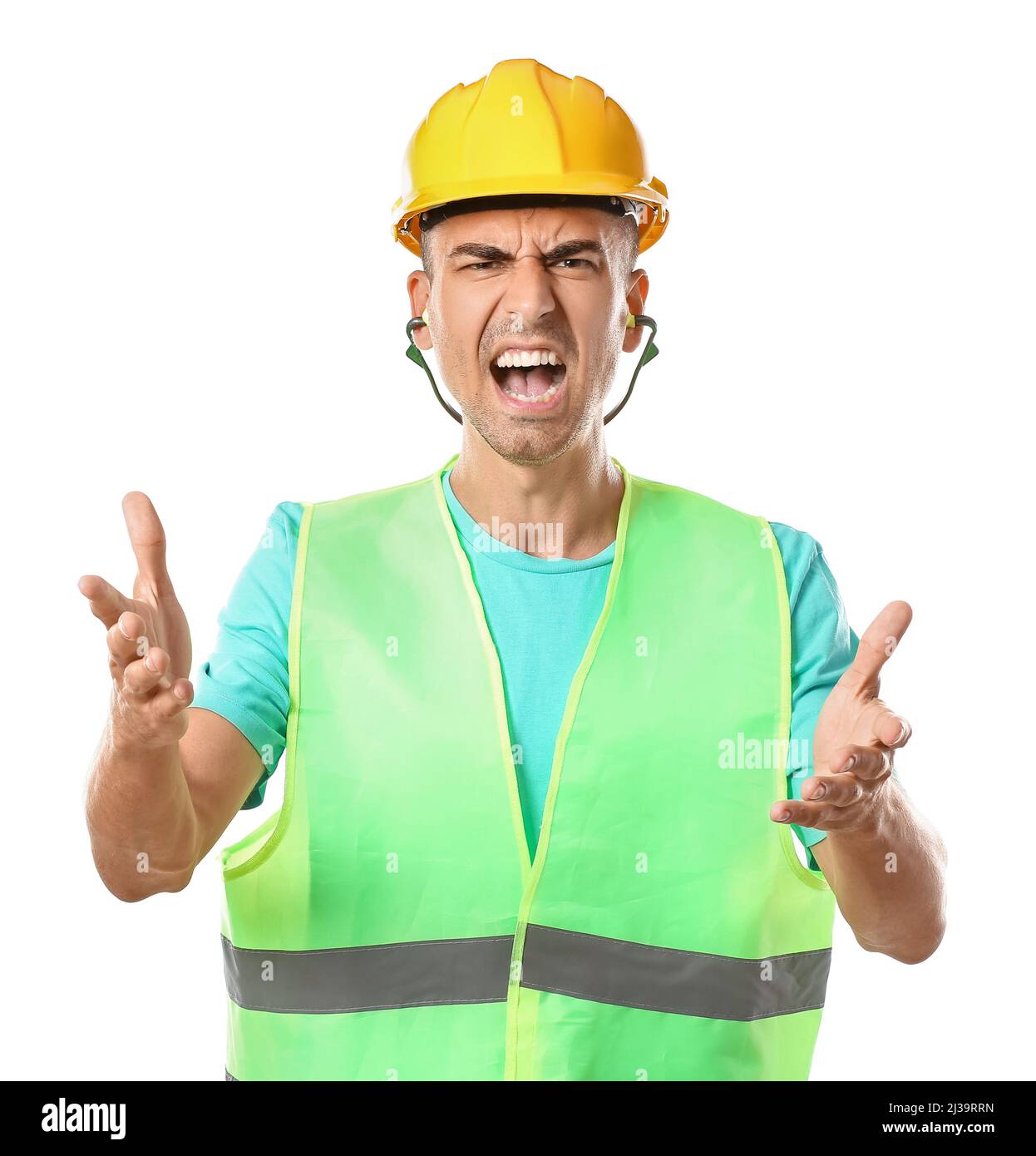 Angry male builder with earplugs on white background Stock Photo - Alamy