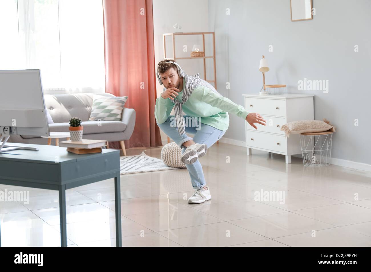 Cool young man learning to dance at home Stock Photo - Alamy