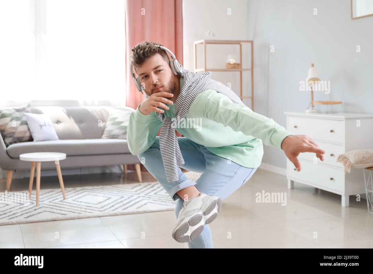 Cool young man dancing at home Stock Photo - Alamy
