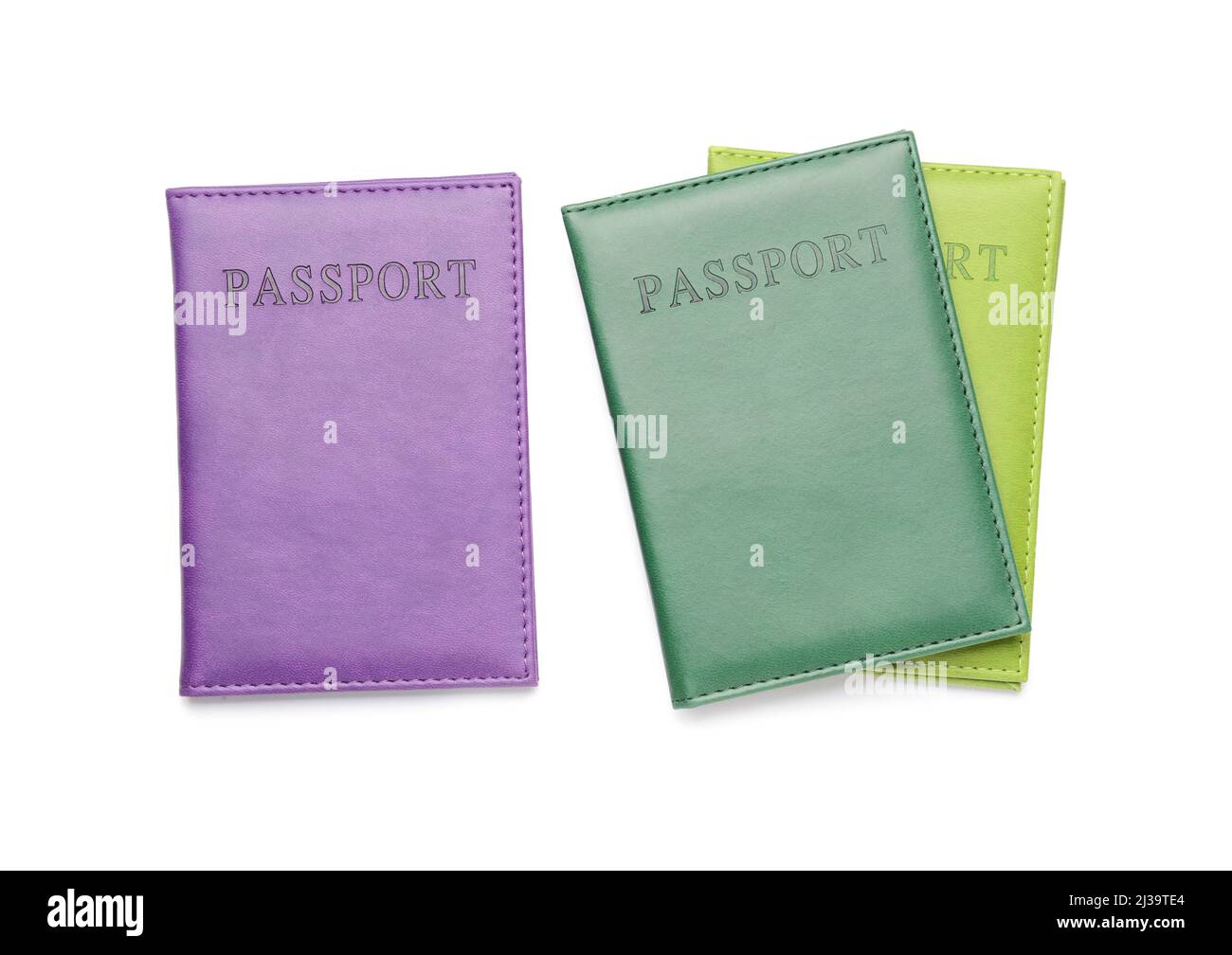 Different passports on white background Stock Photo - Alamy