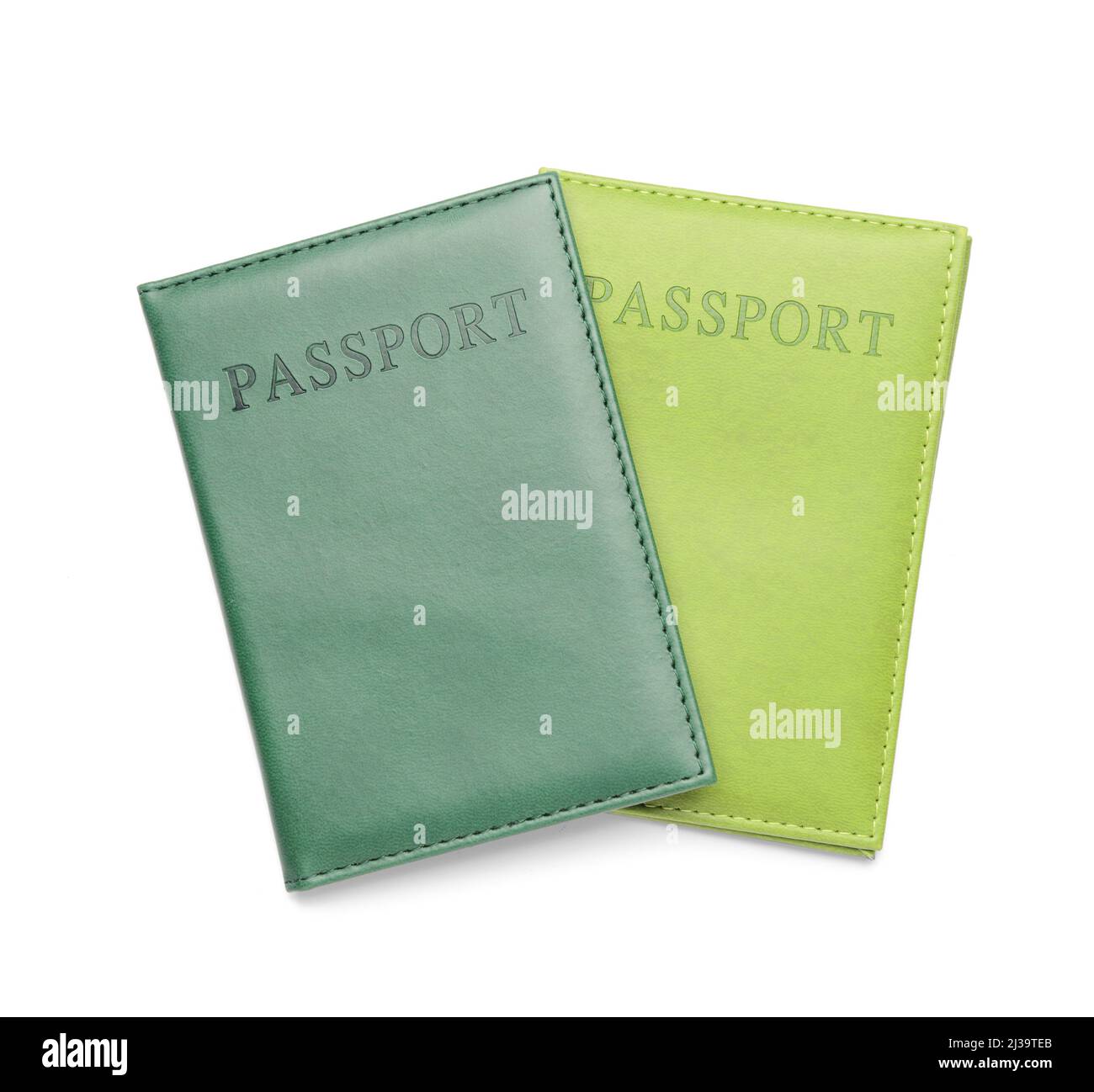 Different passports on white background Stock Photo - Alamy