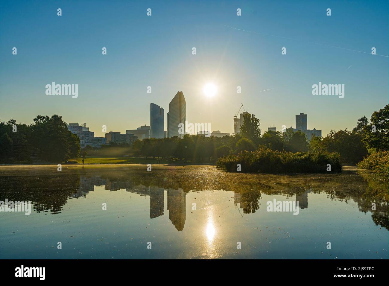 La Defense District Skyline Reflections on Lake With Sun and Trees in ...
