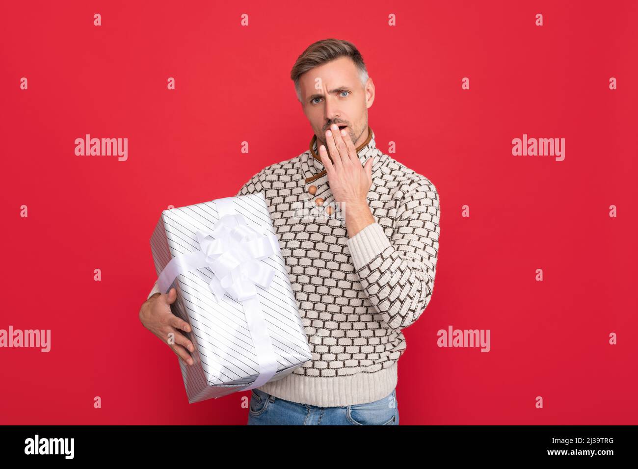 handsome guy prepare for romance date. amazed man showing gift box ...