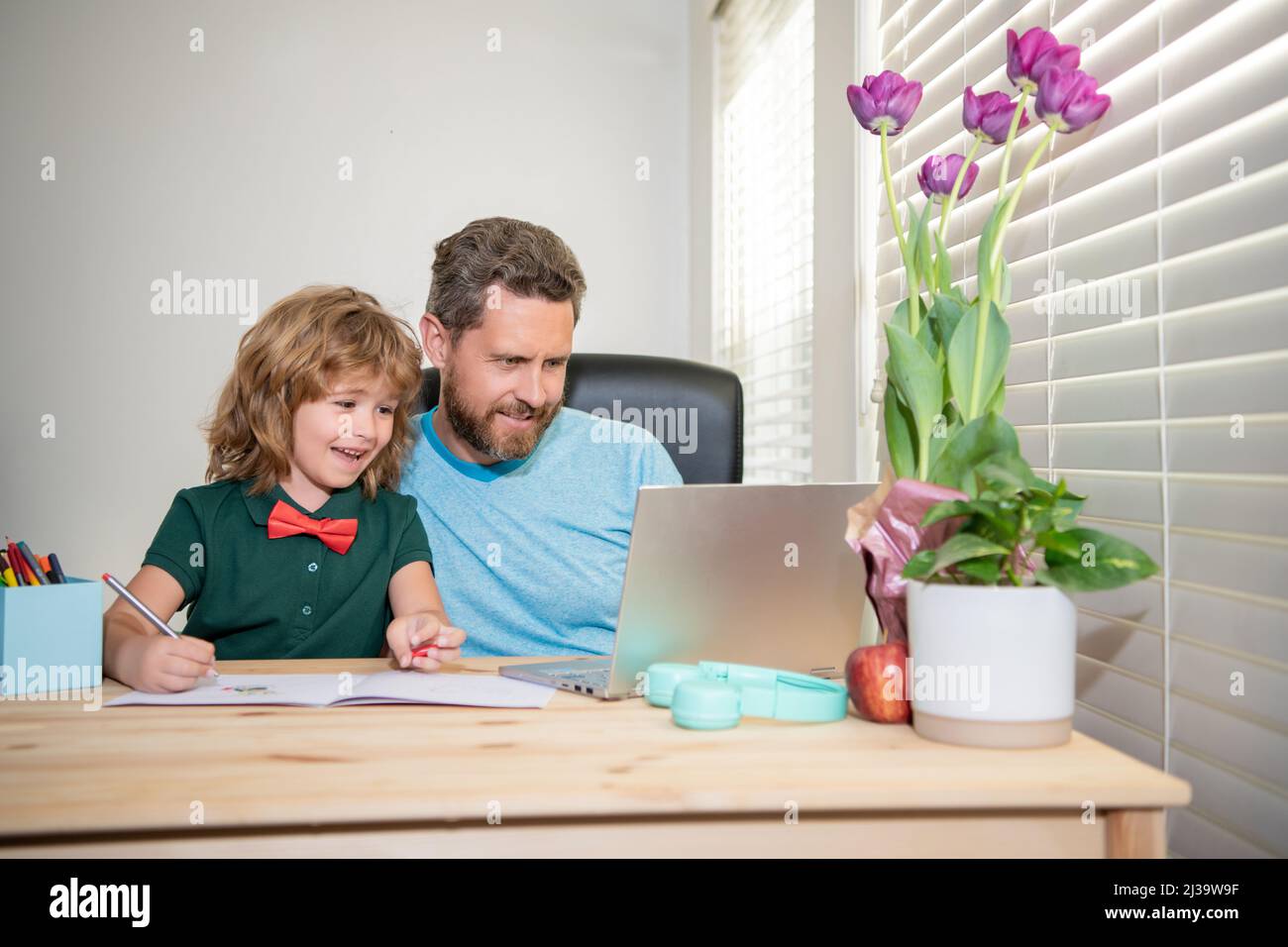 father and kid boy use computer at home. family and parenthood blog ...