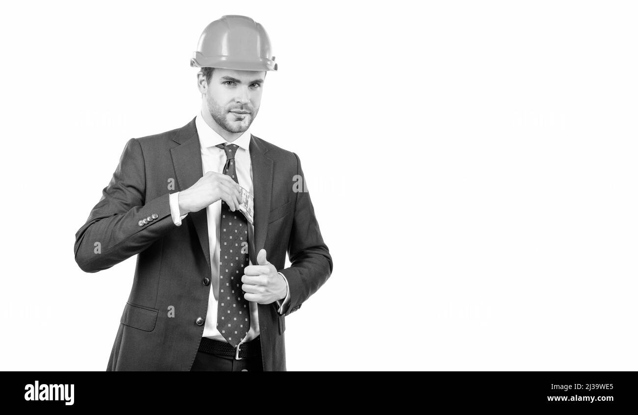 Civil engineer man in hardhat put money cash in jacket pocket isolated ...