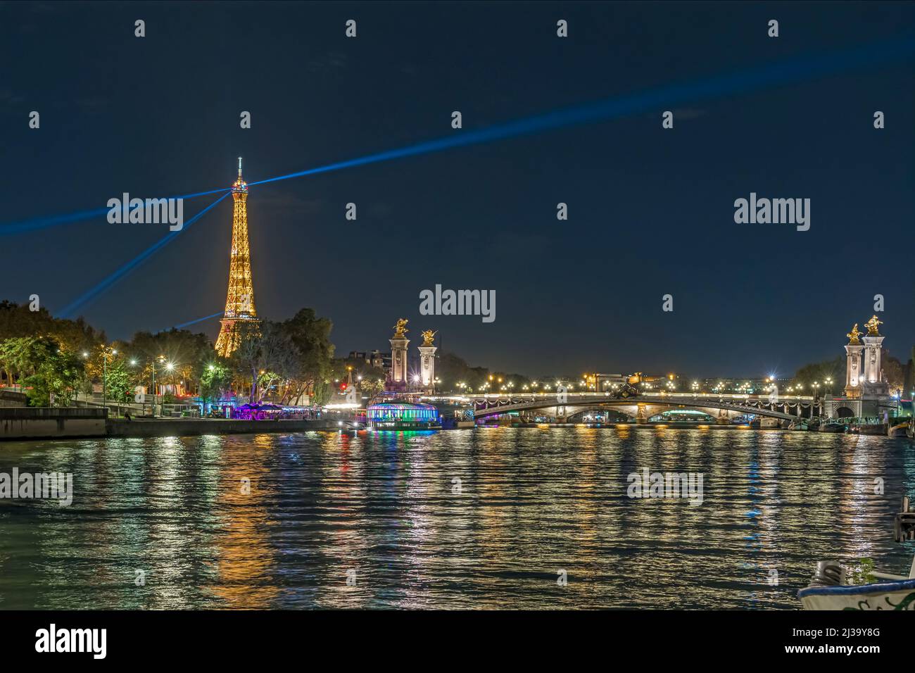 Lights Reflections on Seine River at Night in Paris With Eiffel Tower ...