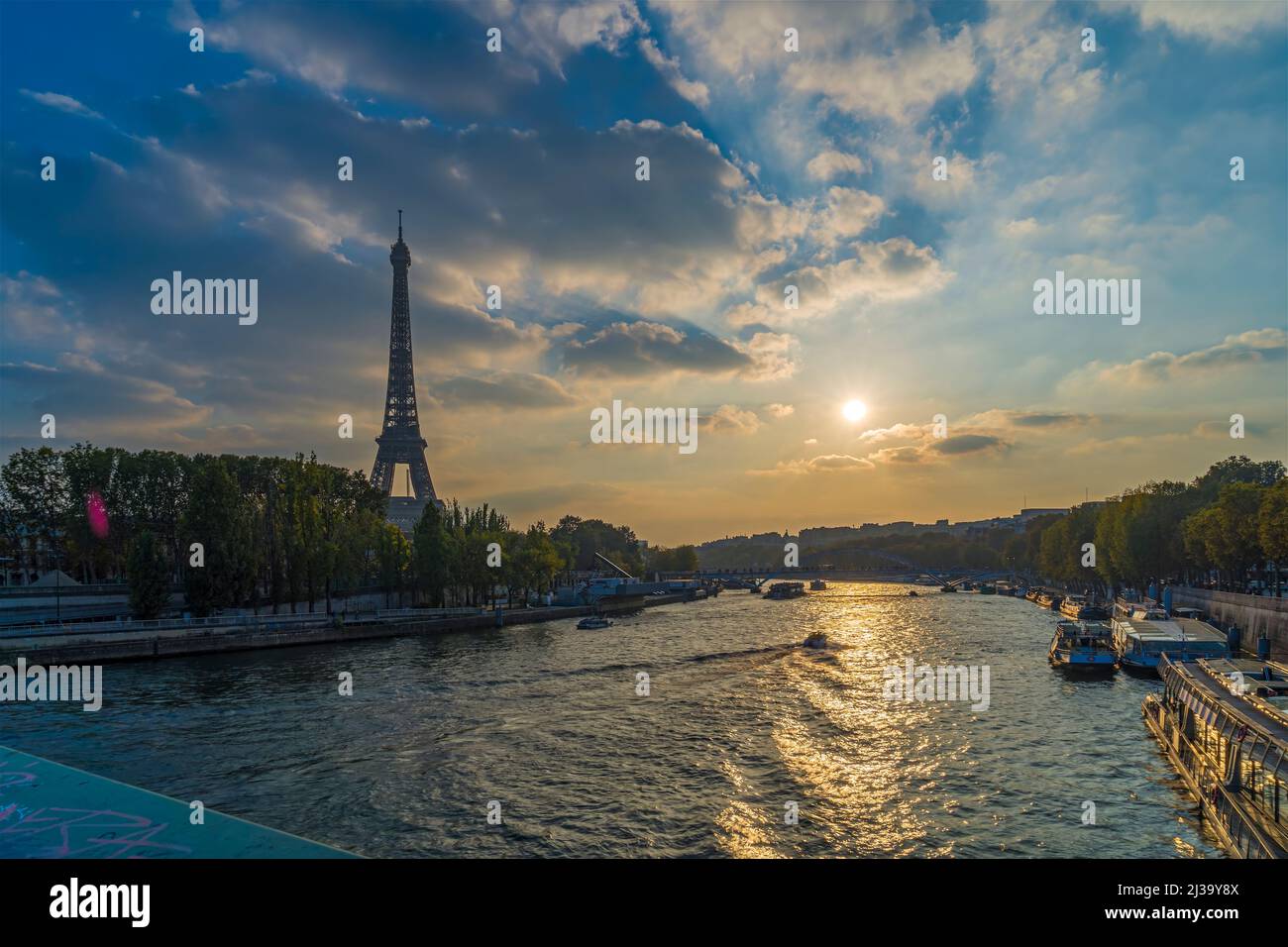 Sunny Day in Paris Eiffel Tower Seine River and Boats Cruises Trees and Clouds Stock Photo - Alamy