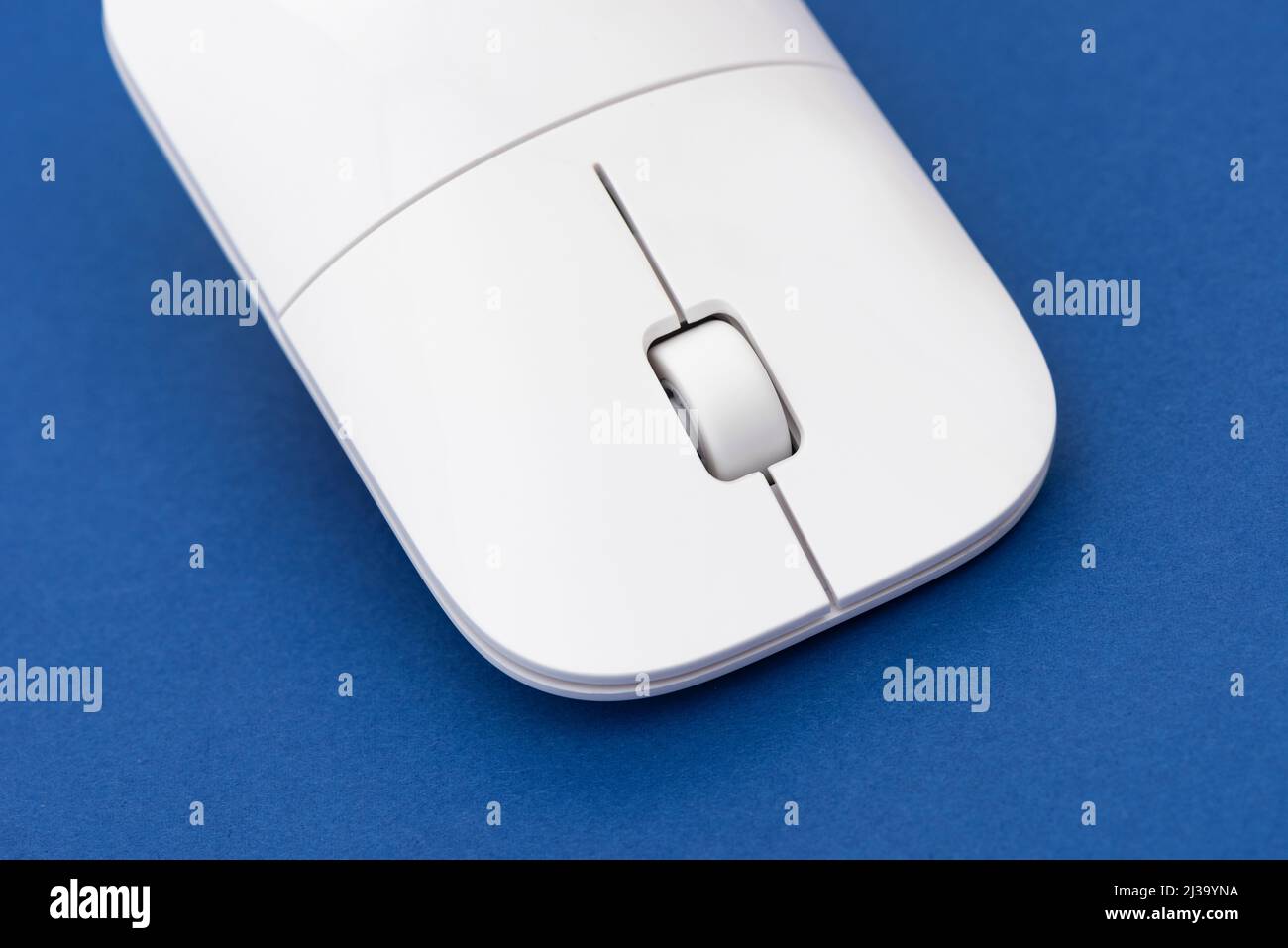 White computer mouse on the blue background Stock Photo - Alamy