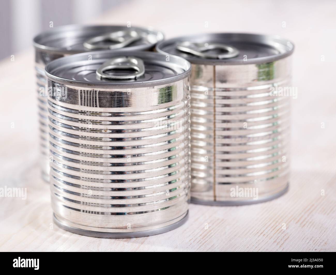 Three empty tin cans hi-res stock photography and images - Alamy