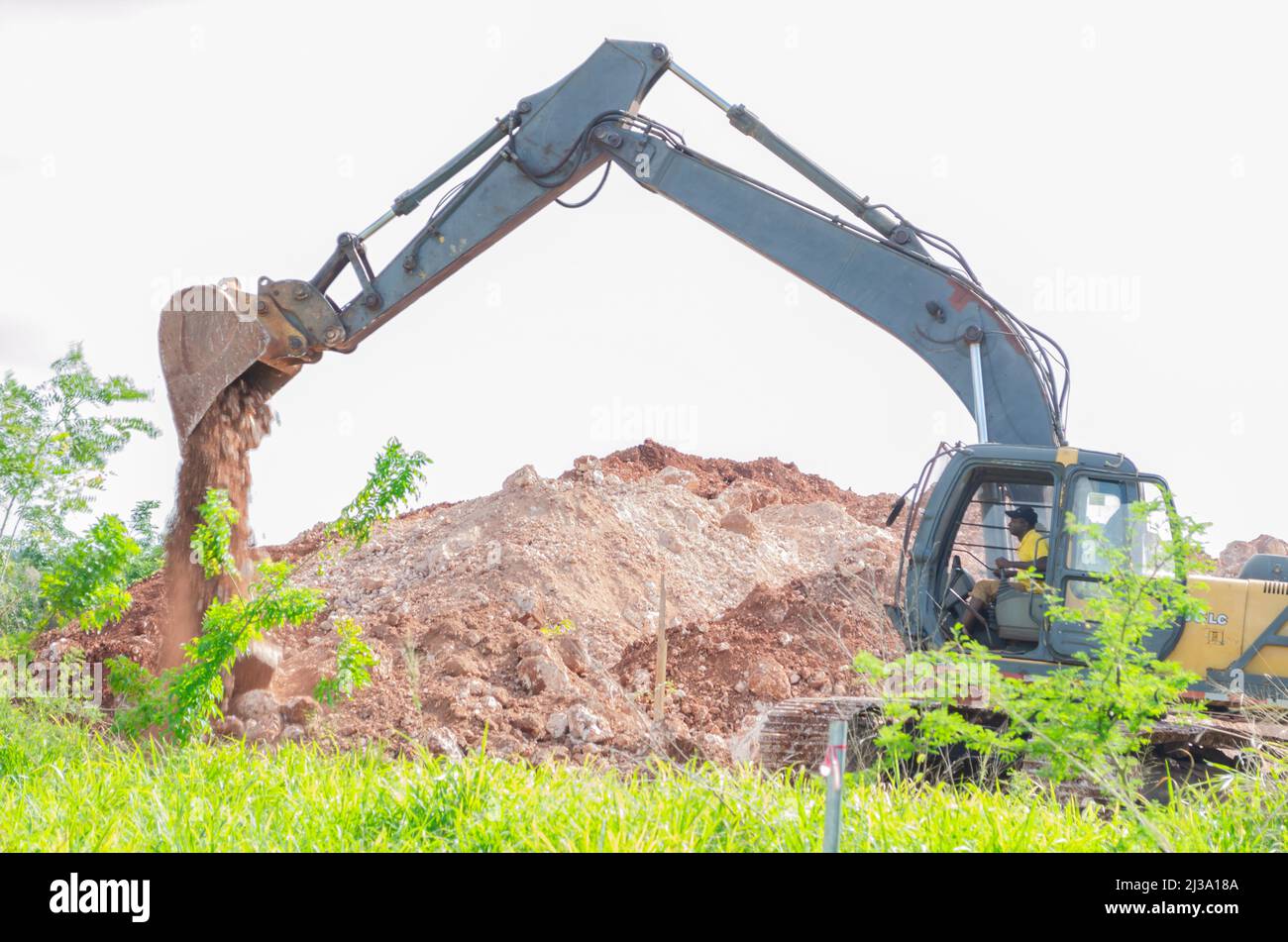 Excavator Pouring Dirt Stock Photo - Alamy