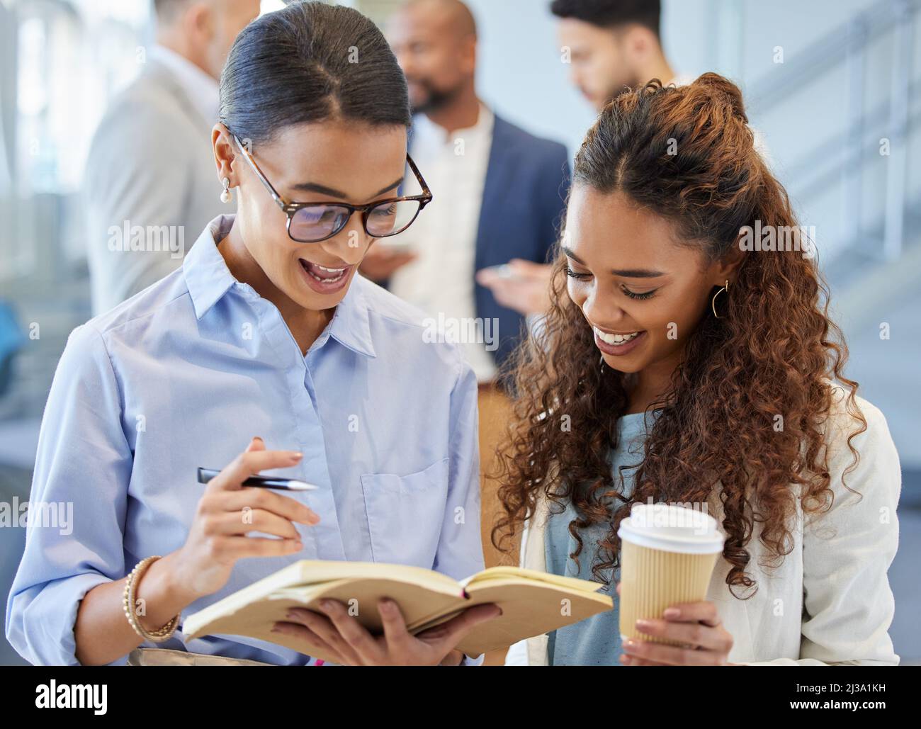 Excited by all their amazing ideas. Shot of two businesswomen going ...