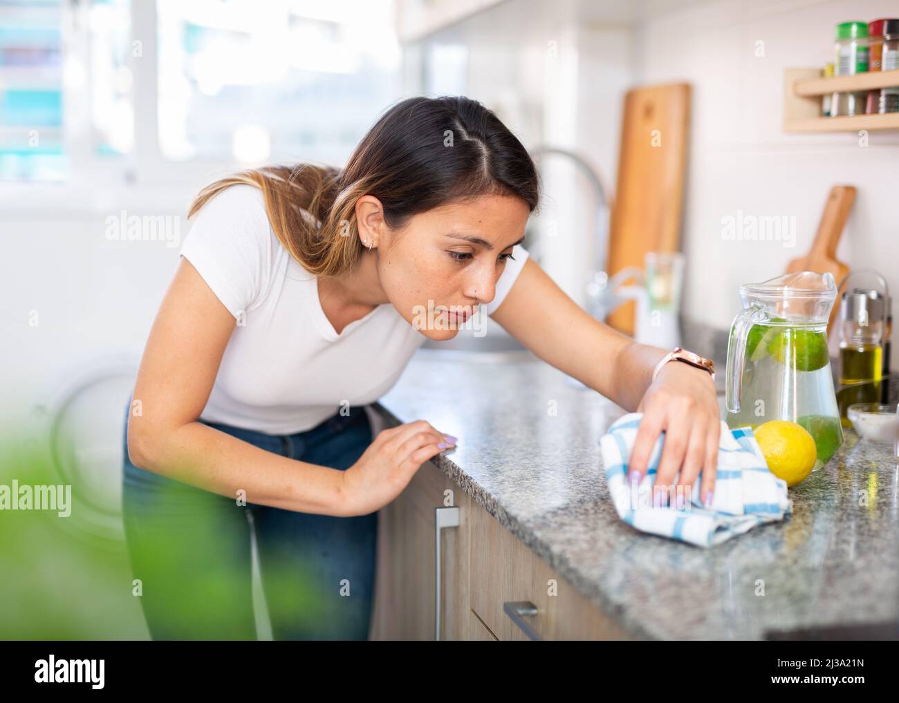 Female is caring about clean of kitchen Stock Photo - Alamy