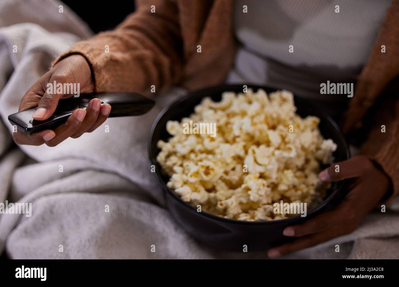 Woman binge eating watching tv hi-res stock photography and images - Alamy