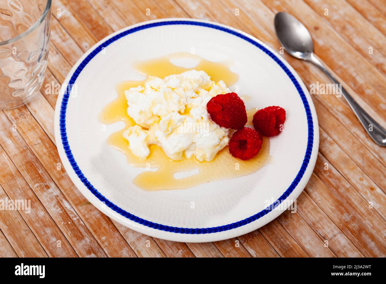 Mato cheese with raspberry and honey Stock Photo - Alamy