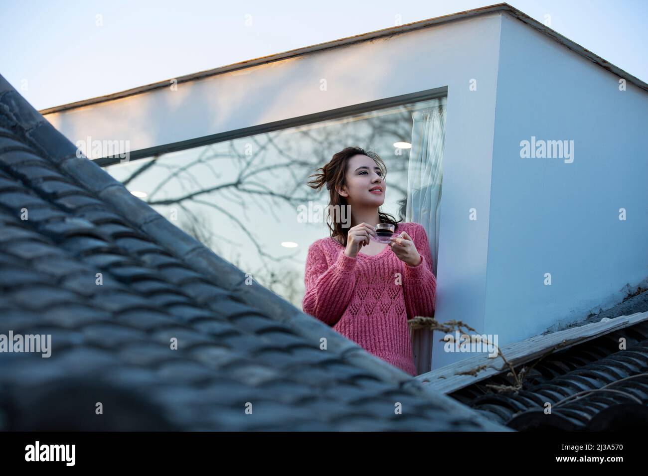 Chinese young lady enjoying the traditional architectural landscape of ...