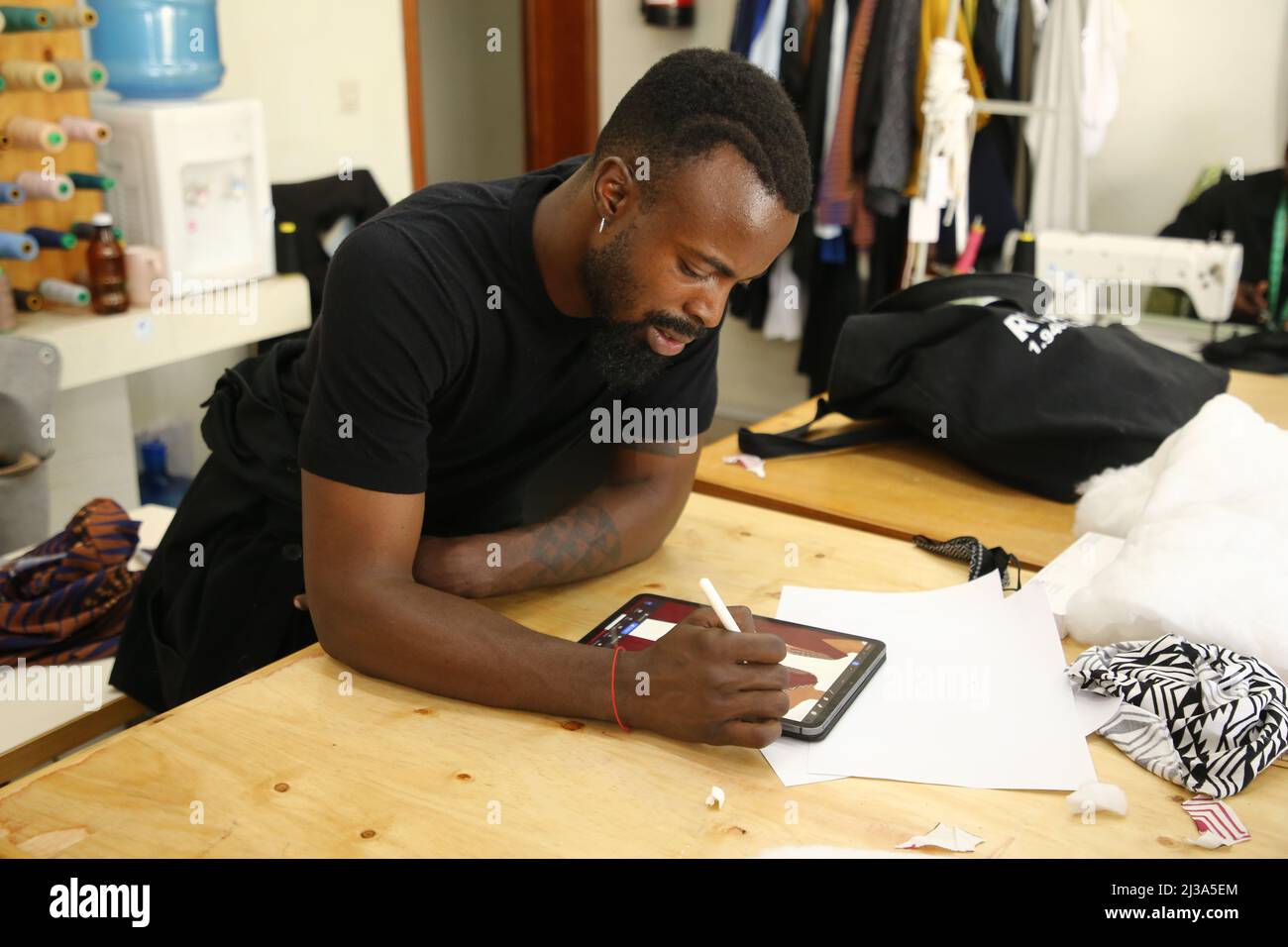 Kigali, Moshions shop in Kigali. 1st Apr, 2022. Moses Turahirwa, the ...