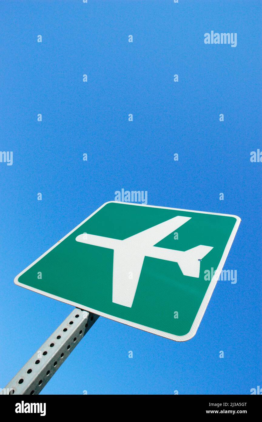 Airport sign with symbol of plane pointing at site for drivers to ...