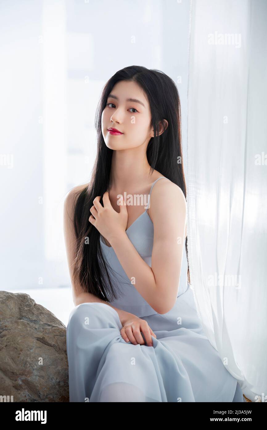 Fashionable Chinese lady with gorgeous clothes and elaborate makeup ...