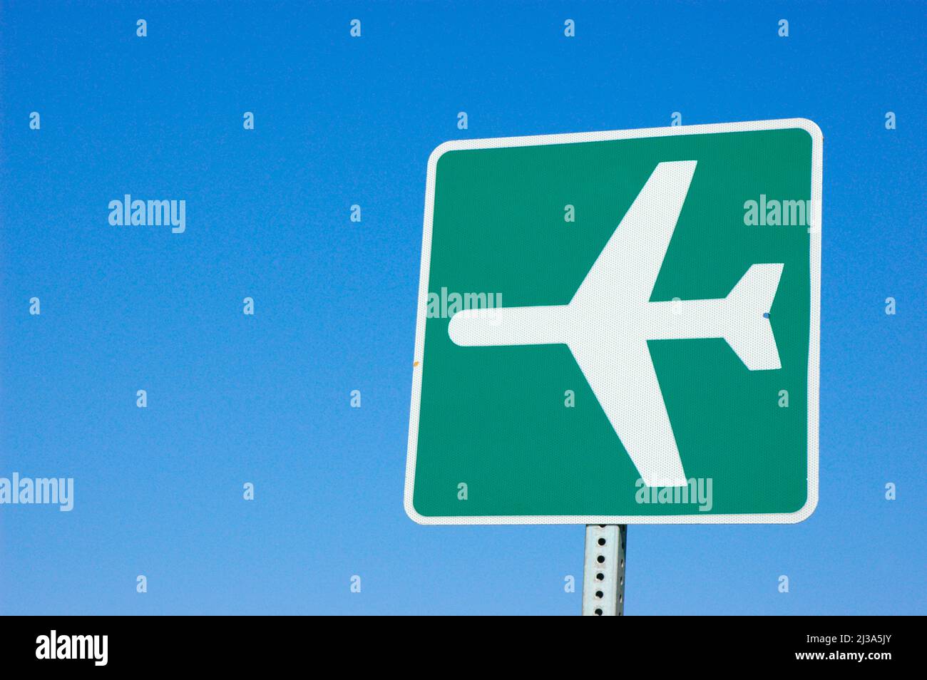 Airport sign with symbol of plane pointing at site for drivers to ...