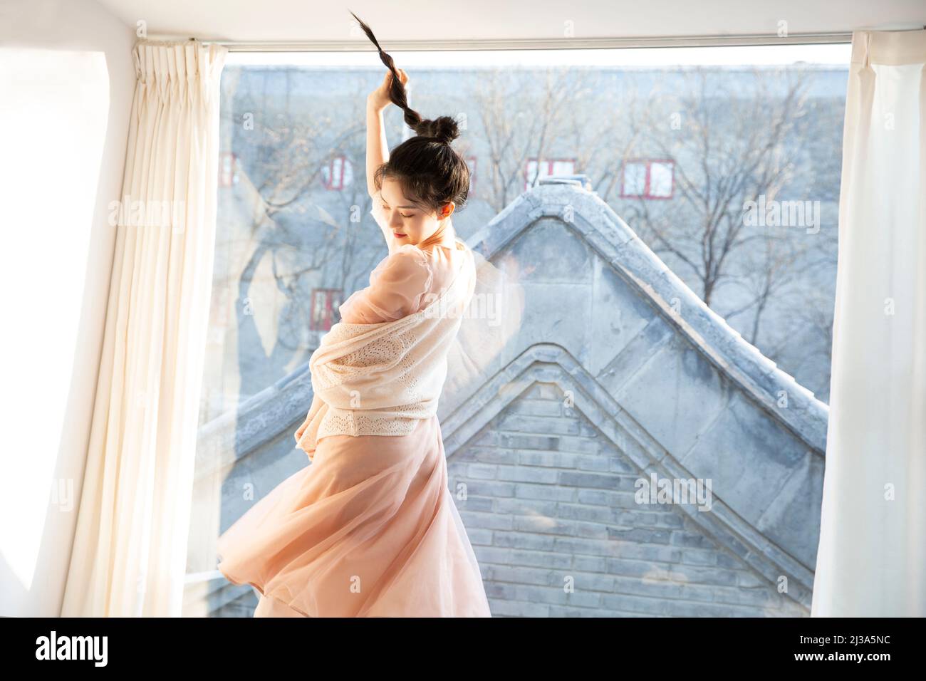 The leisure time of beautiful young fashionable lady in Beijing - stock ...