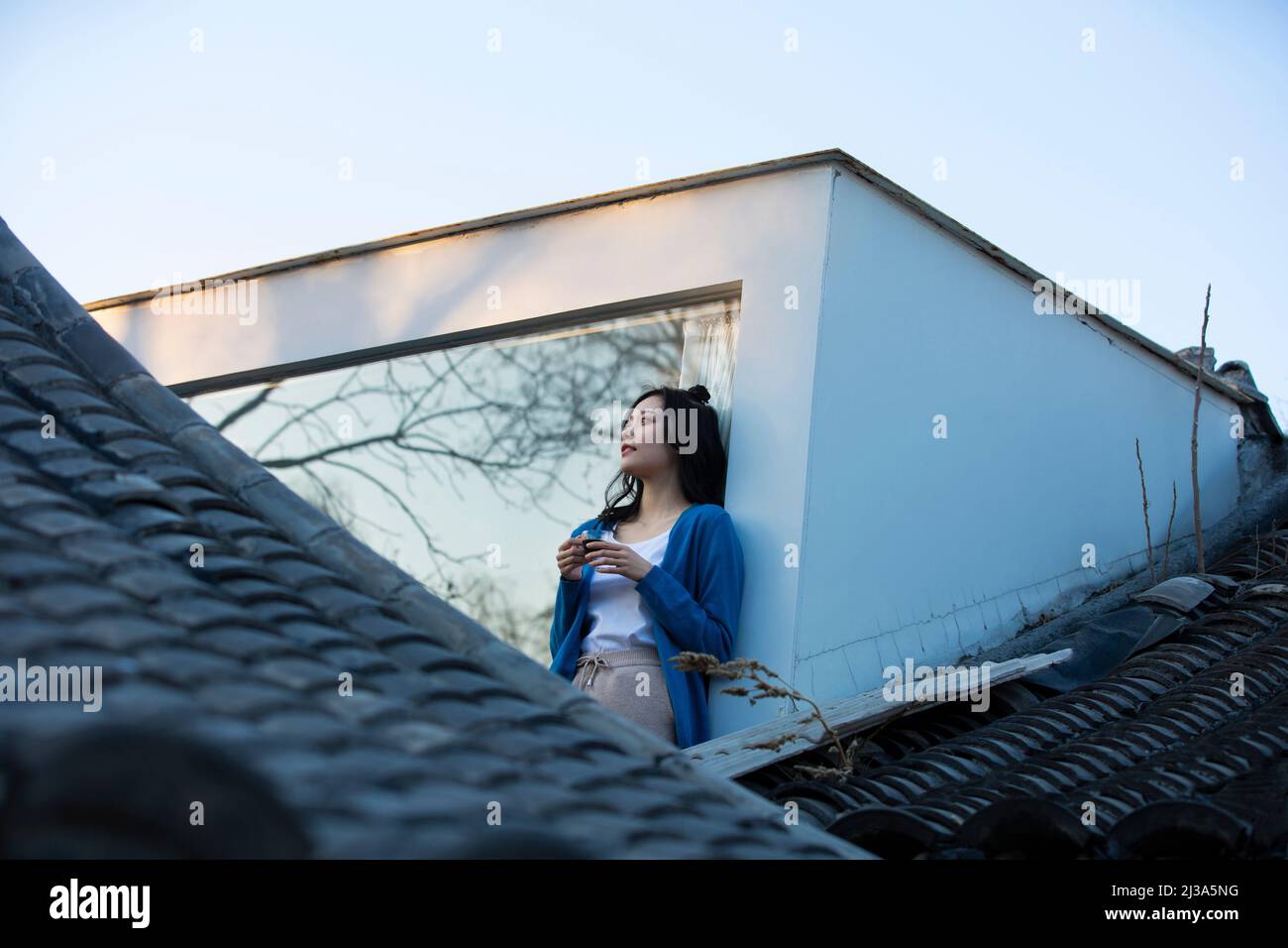 Chinese young lady enjoying the traditional architectural landscape of ...