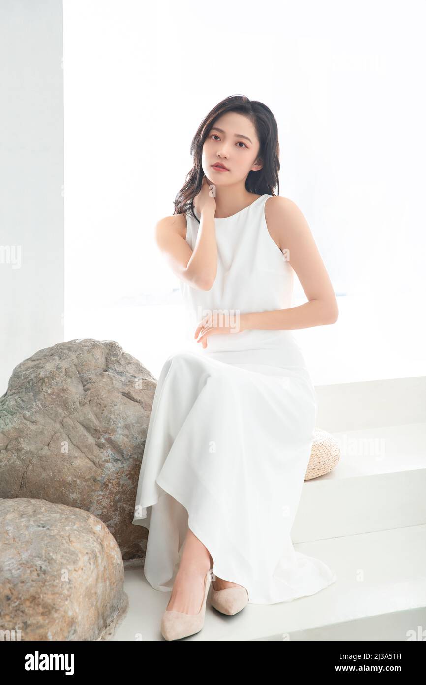 Beautiful young lady with a fine face and fine clothes - stock photo ...