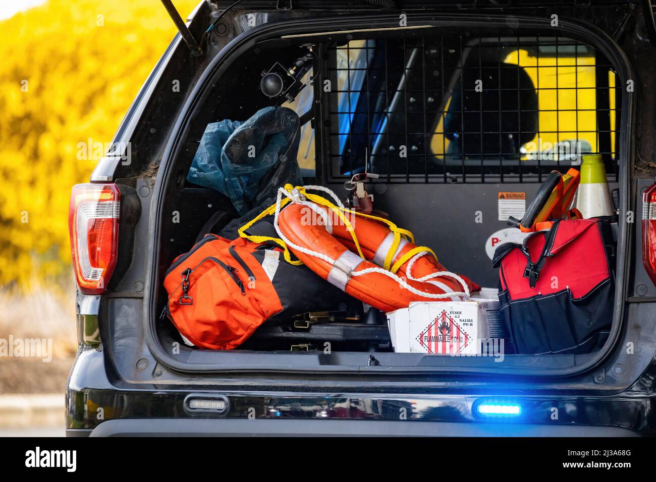 Rescue trunk full of safety accessories items on the road Stock Photo ...
