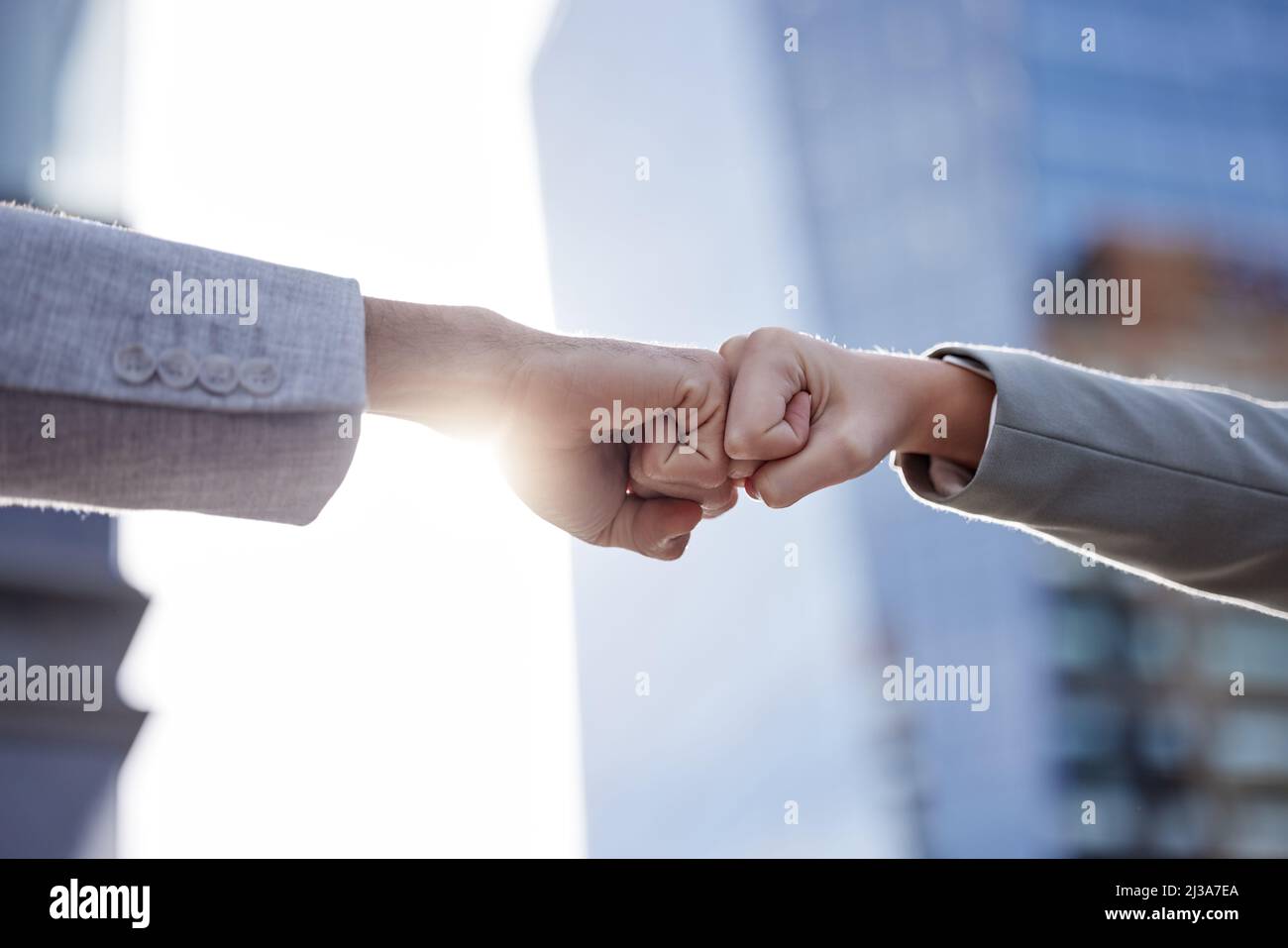 Right on the money. Shot of two unrecognizable businesspeople giving a ...