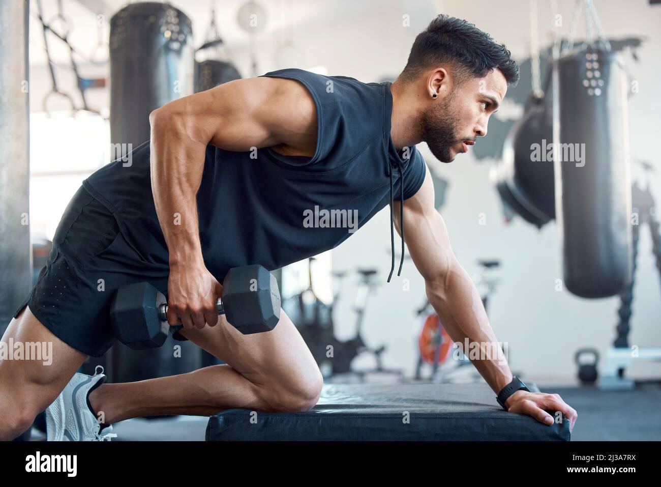 A bad day can be made better by going to the gym. Shot of a sporty ...
