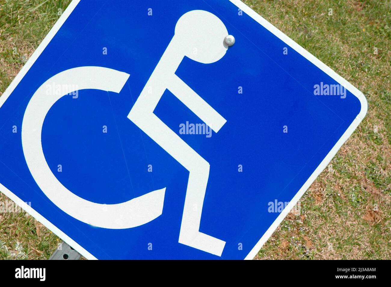 Blue and white wheelchair handicapped sign Stock Photo - Alamy