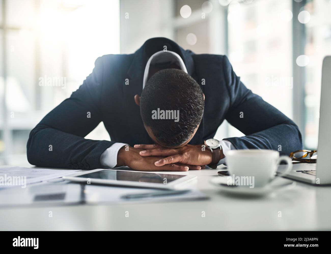 Black businessman sleeping desk hi-res stock photography and images - Alamy